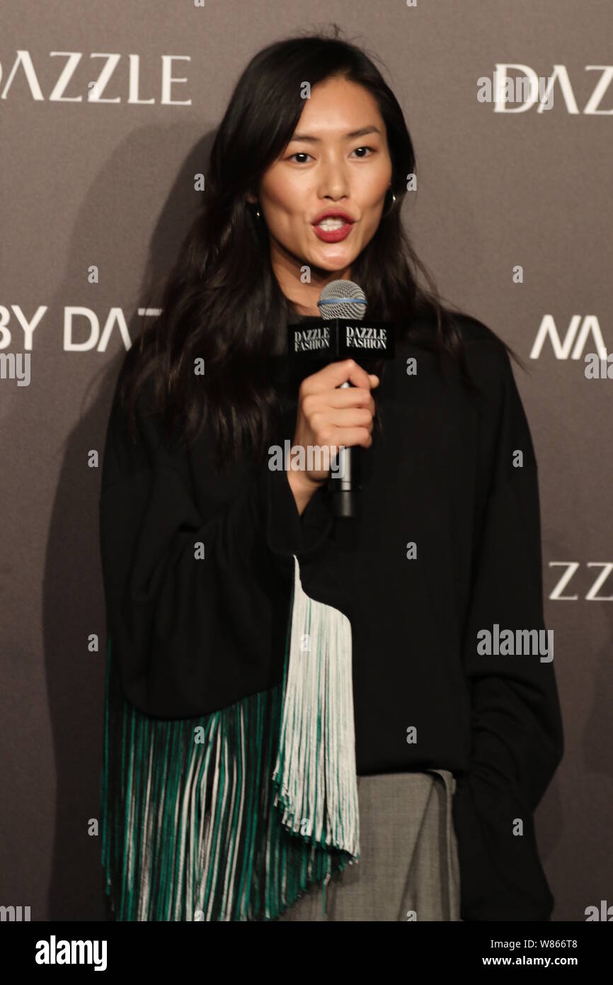 Chinese super model Liu Wen speaks at a fashion show of "DAZZLE" in ...