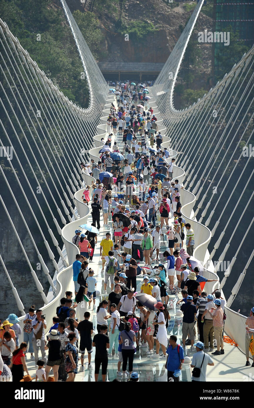 Tourists crowd the world's longest and highest glass-bottomed bridge ...
