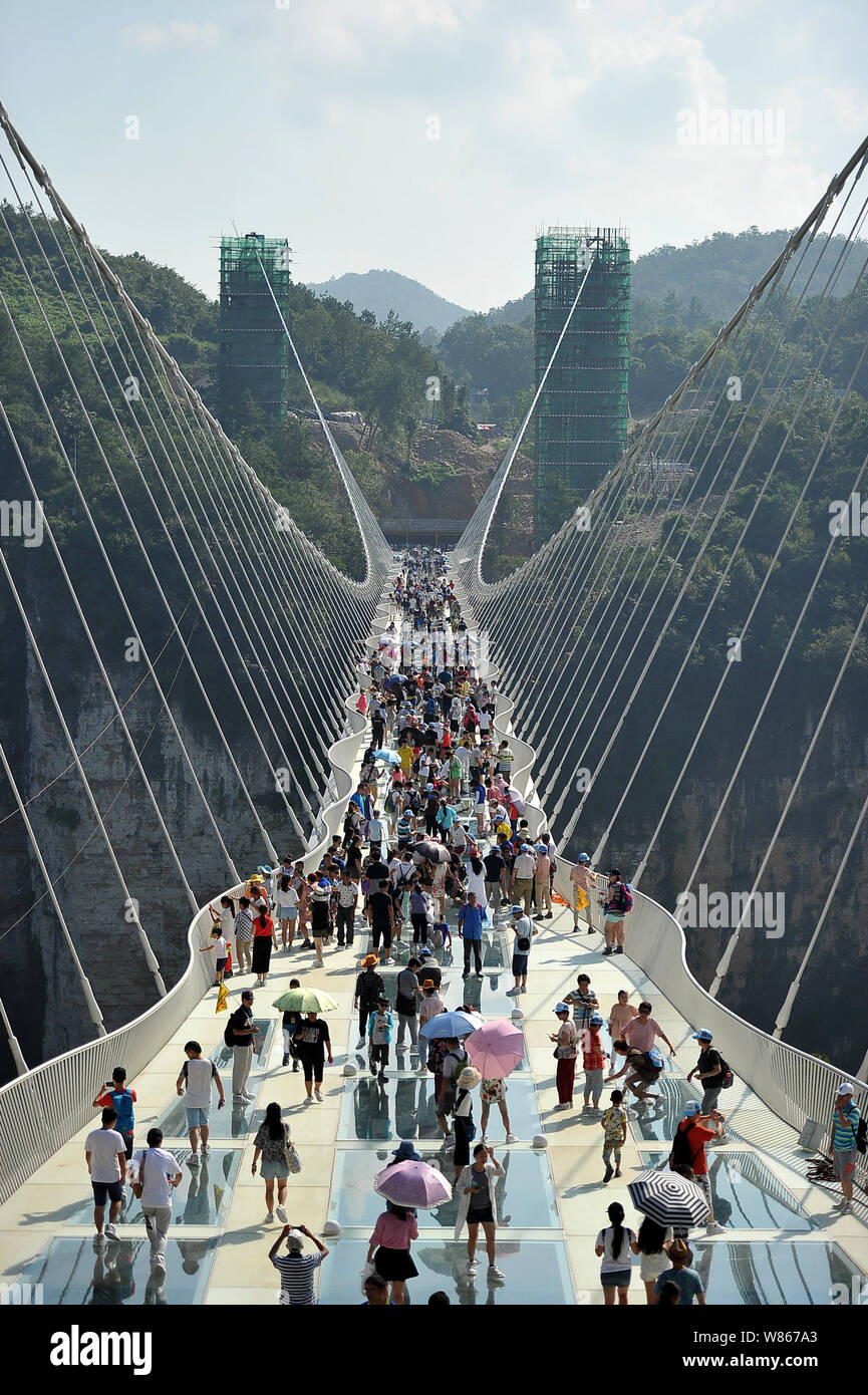 Tourists crowd the world's longest and highest glass-bottomed bridge ...