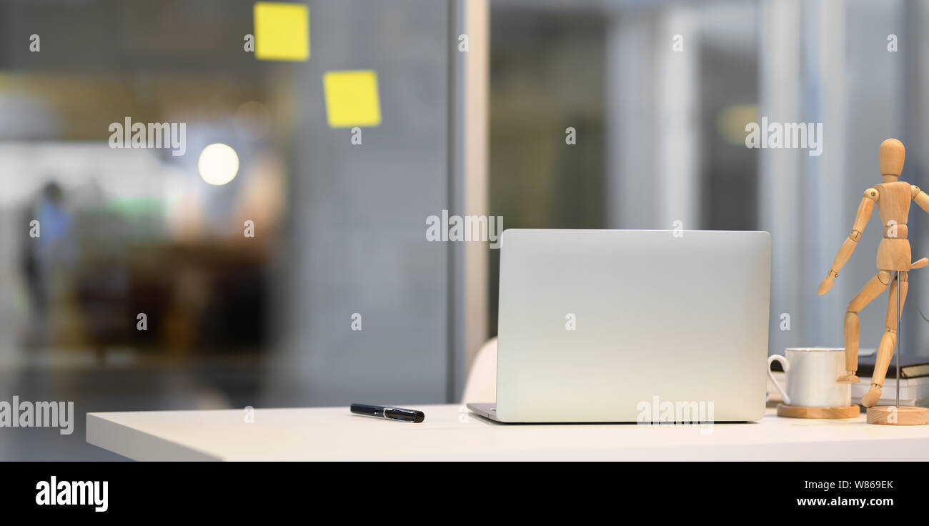 Minimal office room with laptop computer and decorations Stock Photo ...