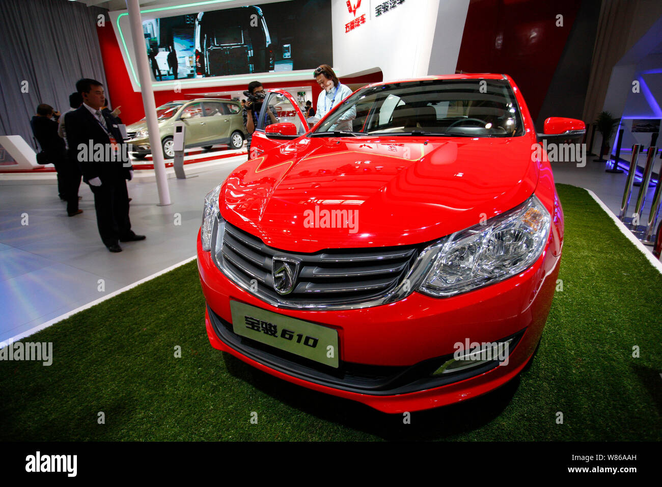 --FILE--Visitors look at a Baojun 610 of SGMW (SAIC-GM-WULING) on ...