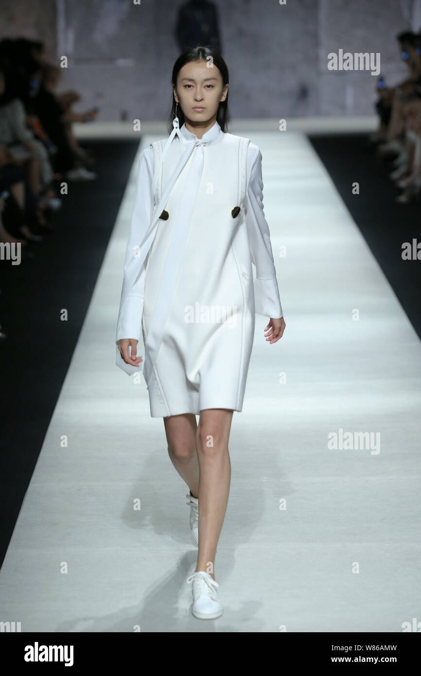 A model displays a new creation by Chinese fashion designer Lv Yan or ...