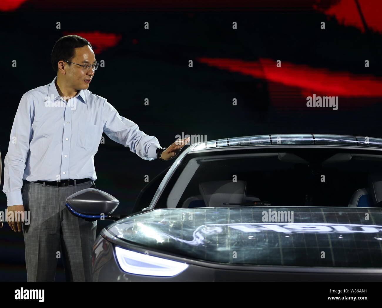 Li Hejun, Chairman and CEO of Hanergy Holding Group Limited, strokes a ...