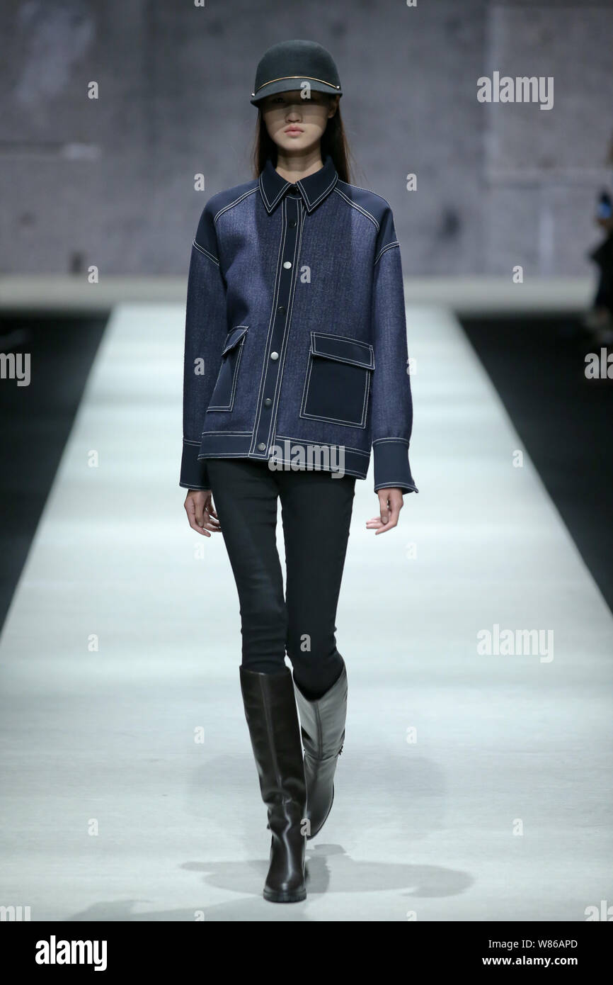 A model displays a new creation by Chinese fashion designer Lv Yan or ...