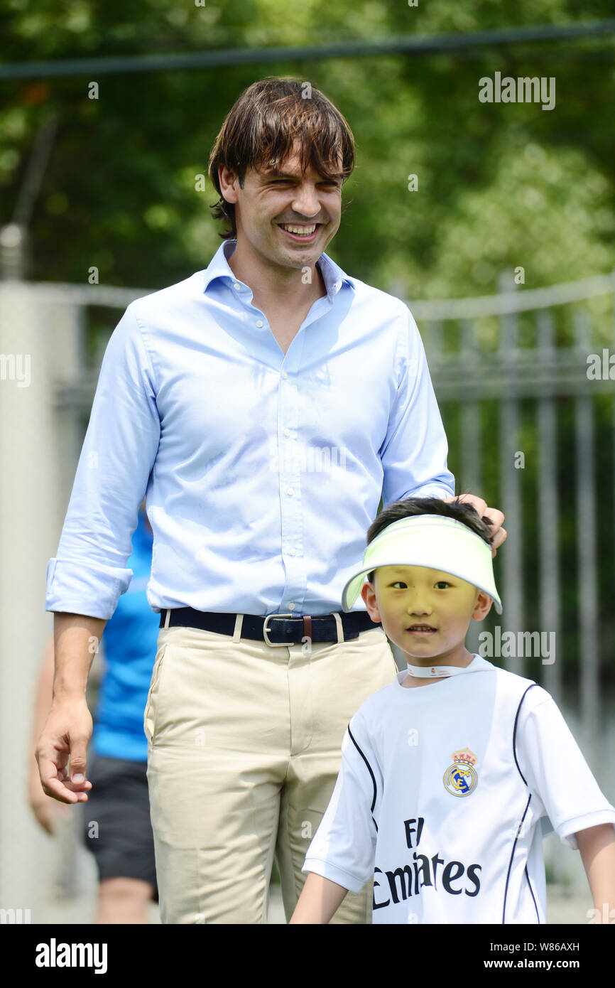 Retired Spanish football player Fernando Morientes poses with a young ...
