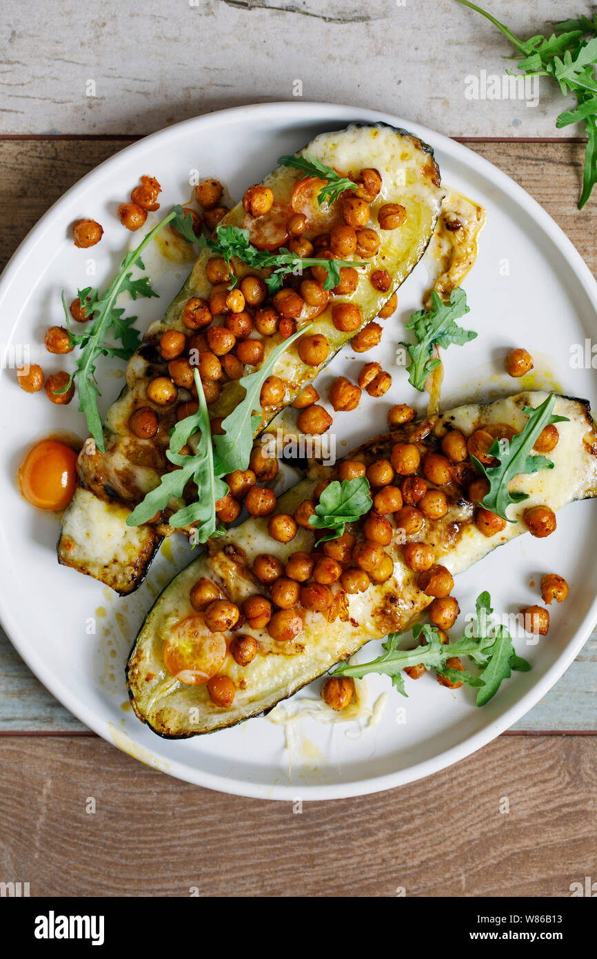 Baked courgette with cheese and crispy spicy chickpeas Stock Photo - Alamy