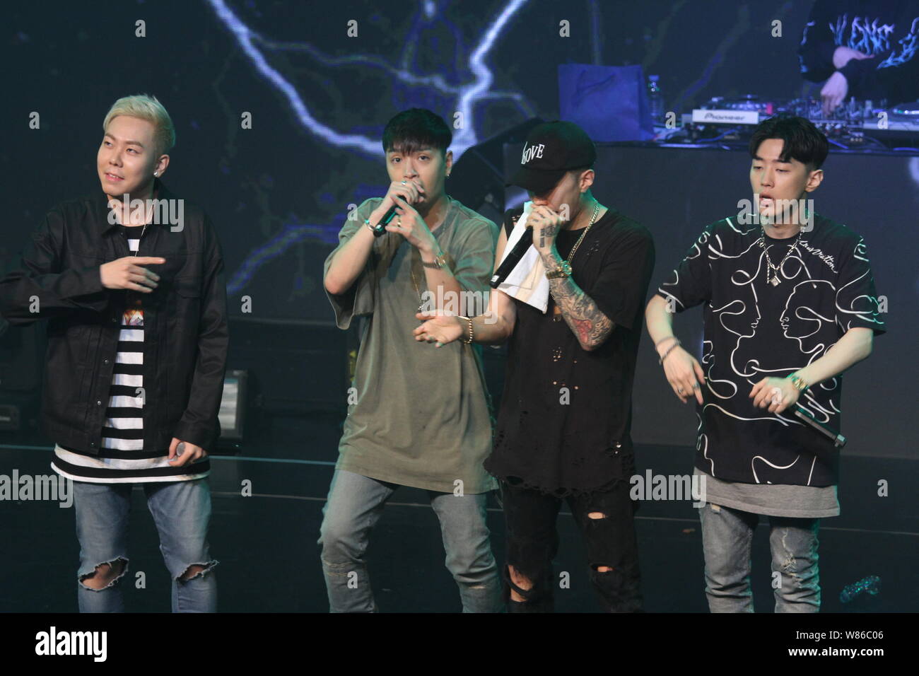 Members of South Korean idol group AOMG perform at their concert in ...