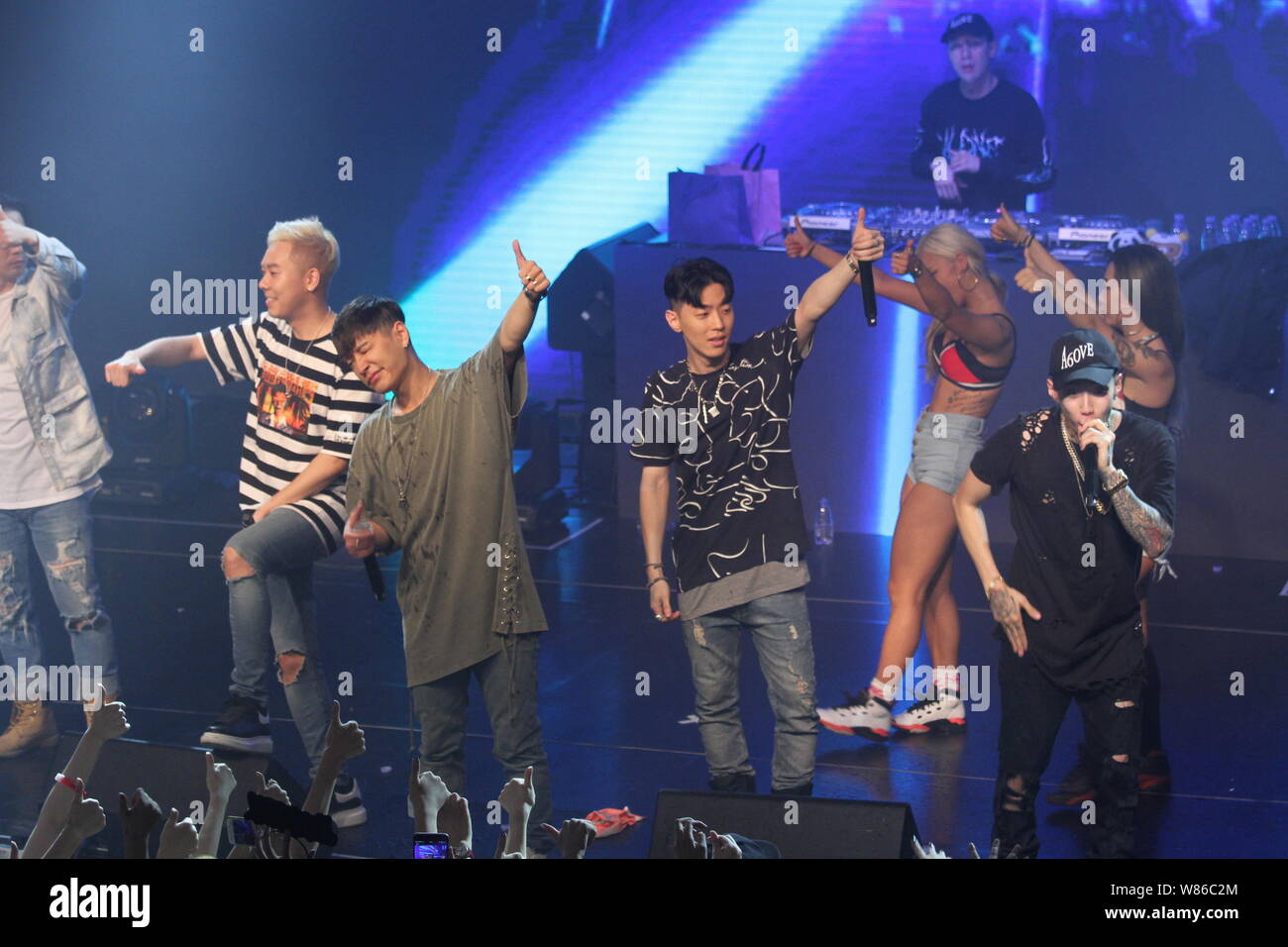 Members of South Korean idol group AOMG perform at their concert in ...
