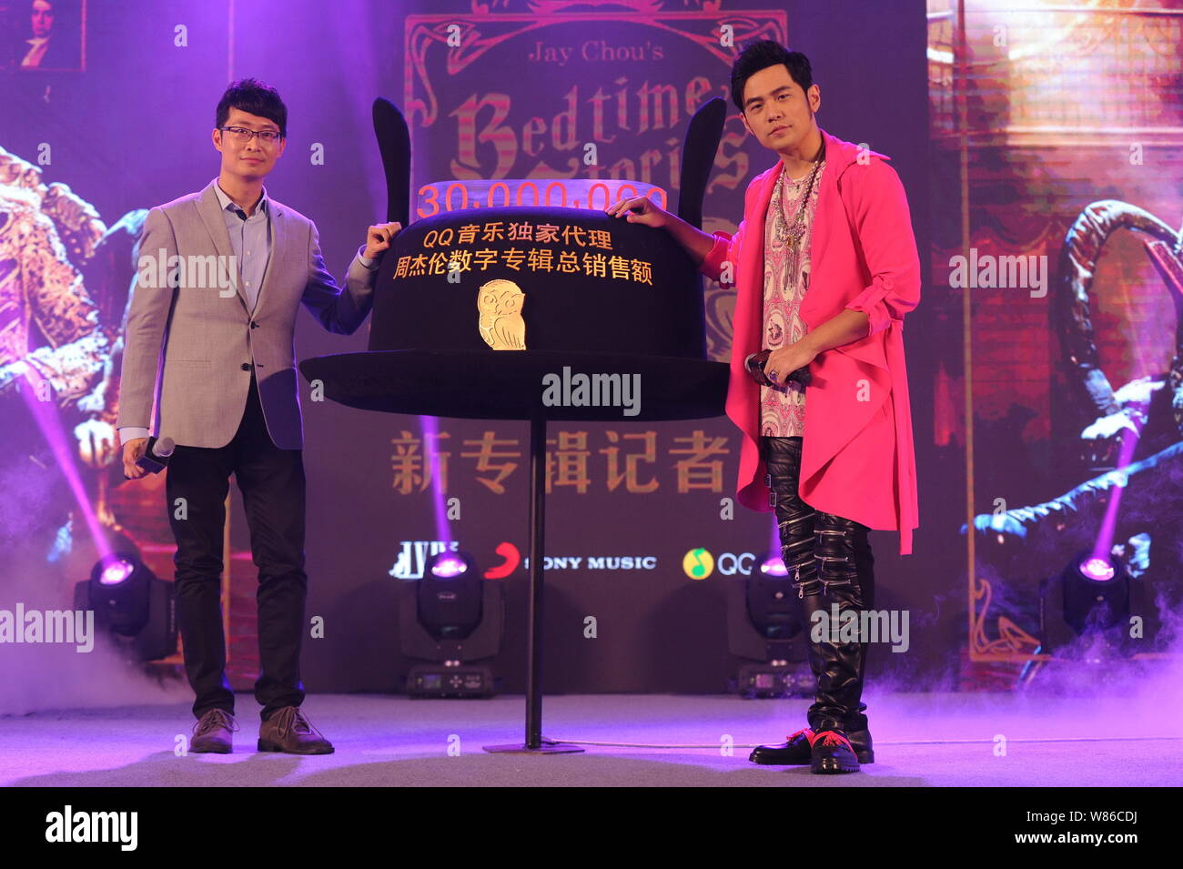 Taiwanese singer Jay Chou, right, poses at a press conference for his ...