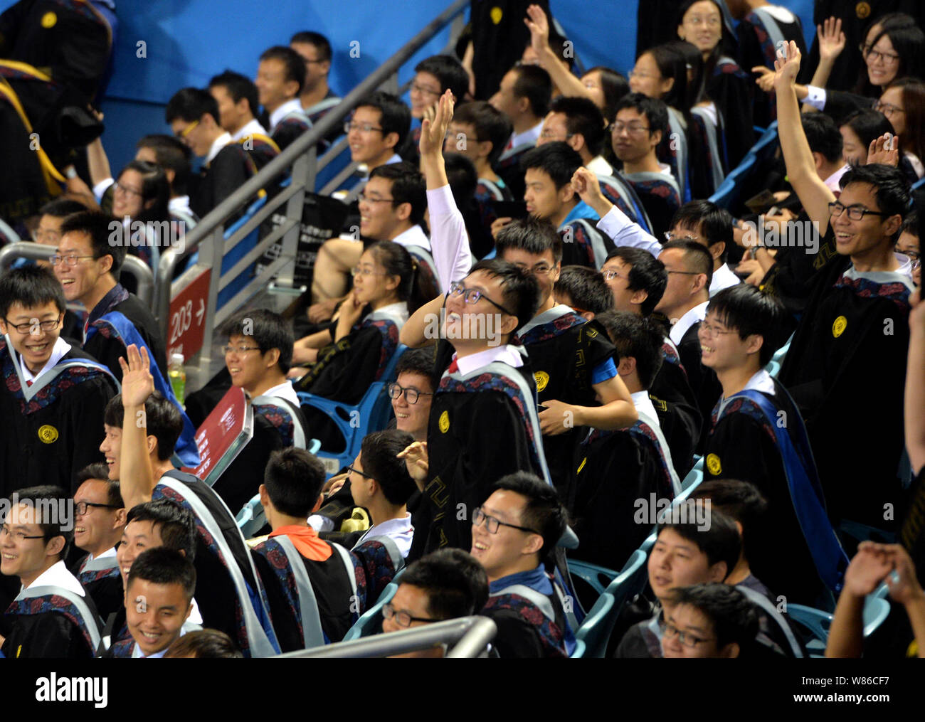 Graduates attend the graduation ceremony of Peking University in ...
