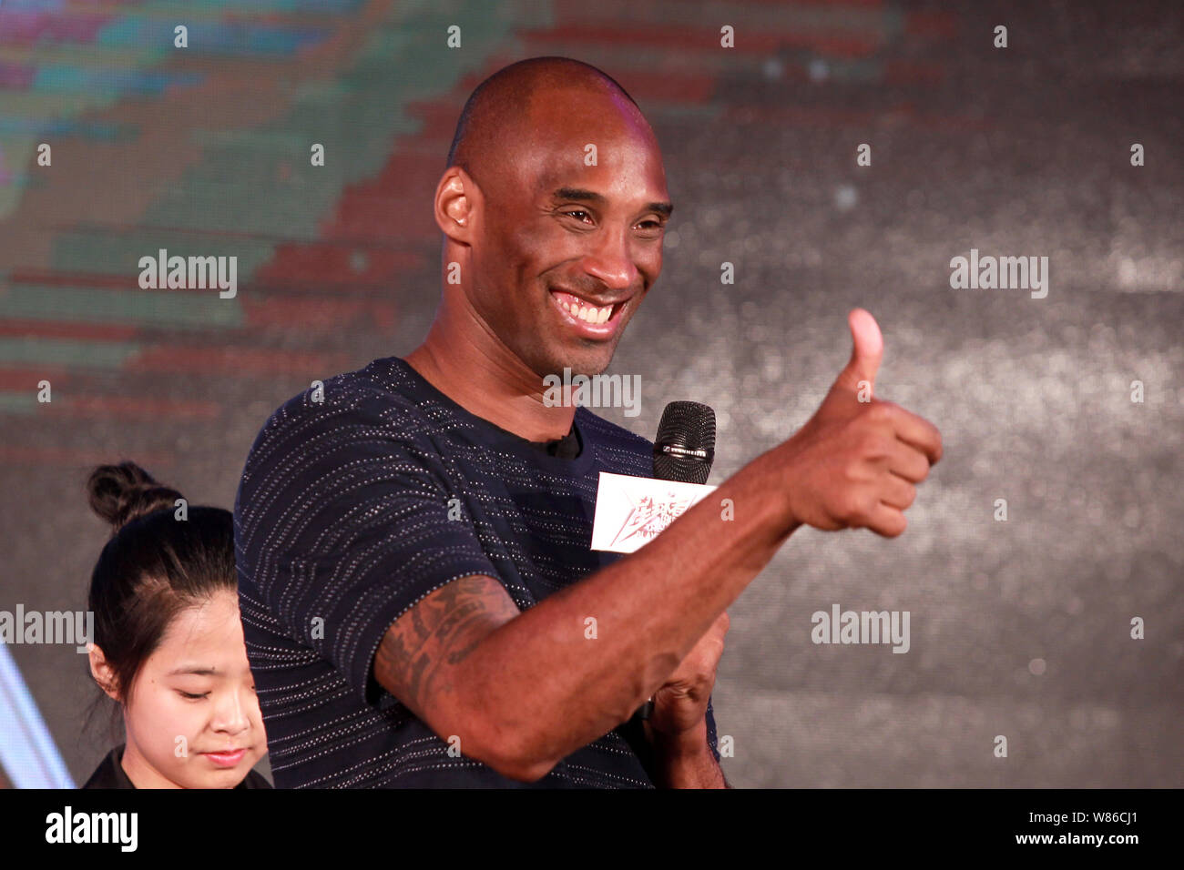 --FILE--Retired NBA star Kobe Bryant poses at a press conference for ...