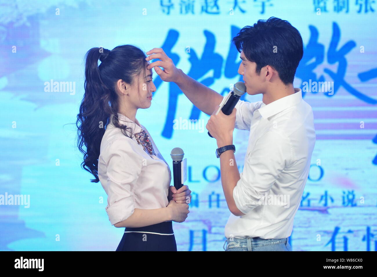 Hong Kong model and actress Angelababy, left, and Chinese actor Jing ...