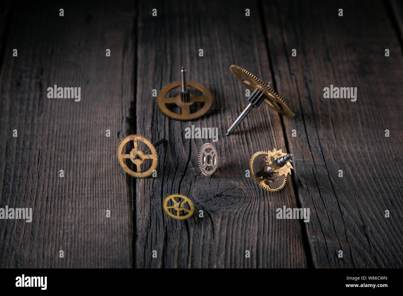 Clockwork gears on wooden boards. Good idea vintage, time from the ...