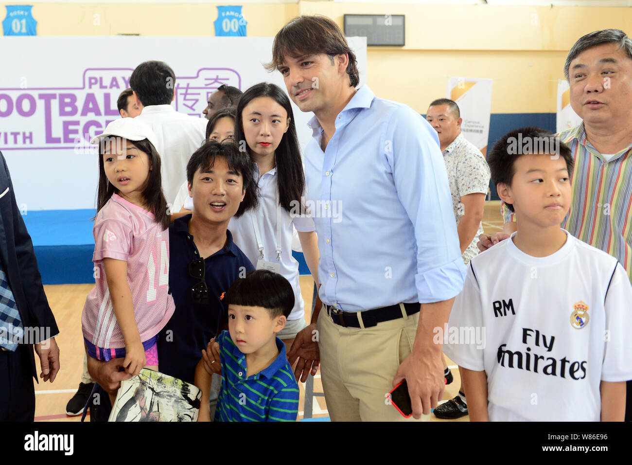 Retired Spanish football player Fernando Morientes, center, poses with ...