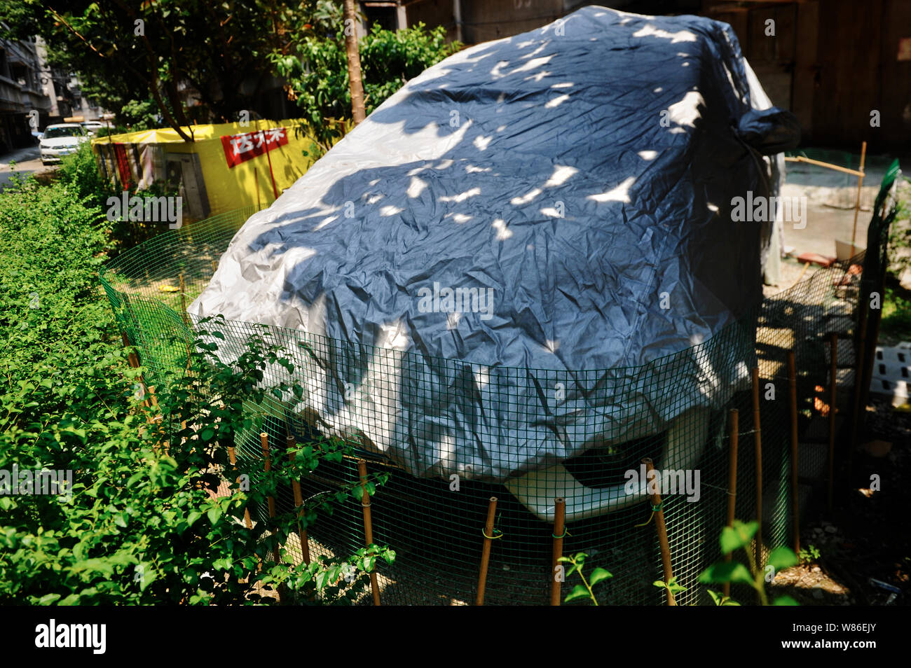 A car is encircled by a steel netting to prevent mice from invasion at ...