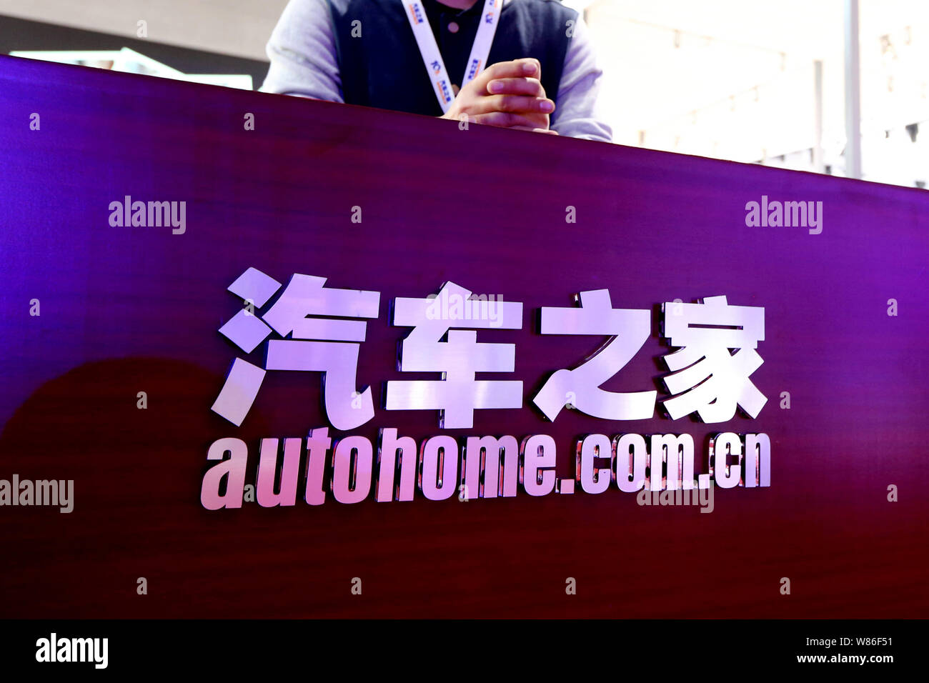 --FILE--A Chinese employee is seen at the stand of Chinese automobile ...