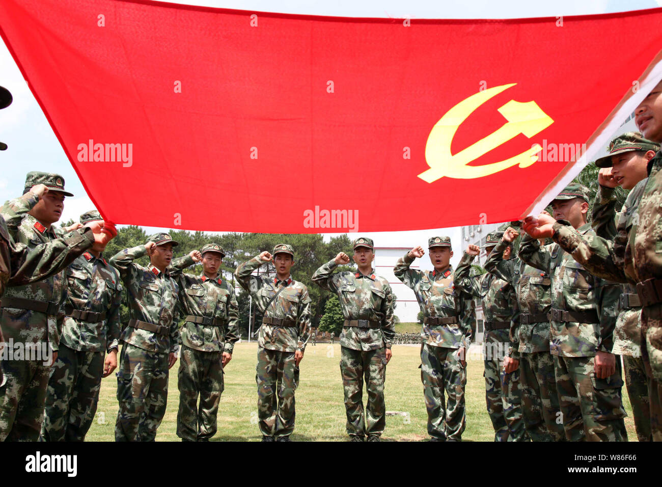 Chinese paramilitary policemen, also members of the Communist Party of ...