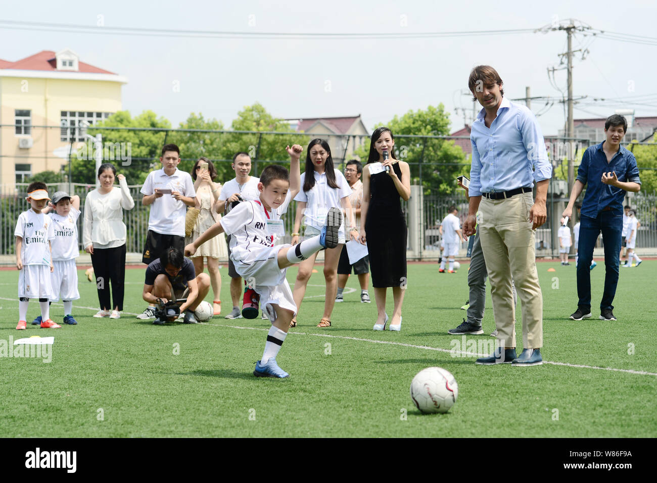 Retired Spanish football player Fernando Morientes, right, instructs a ...