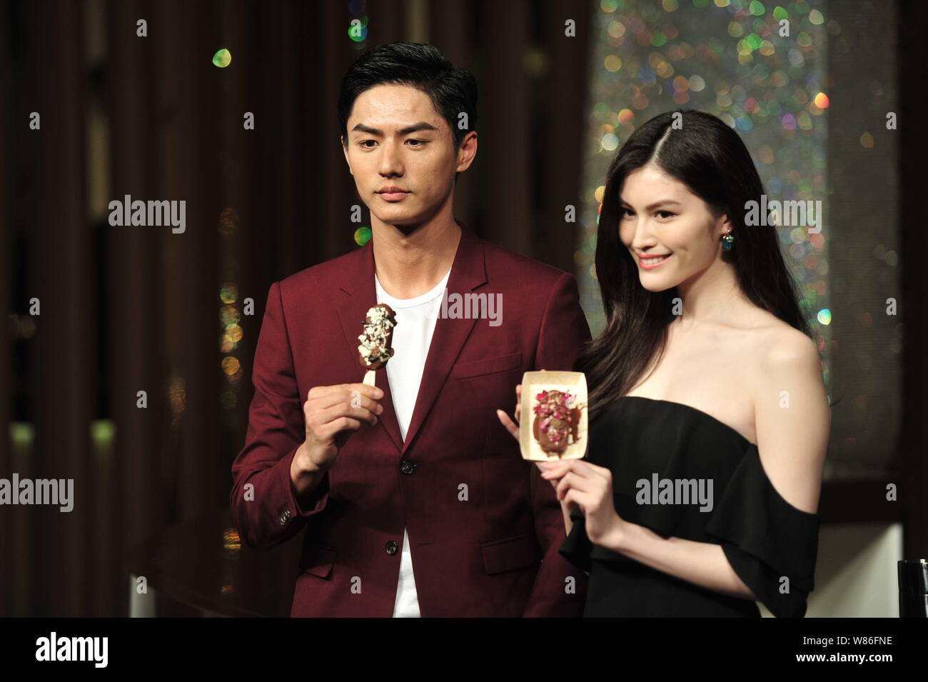 Chinese model and actress He Sui, right, model and actor Liu Chang show ...