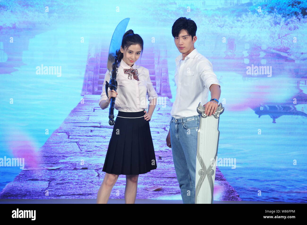 Hong Kong model and actress Angelababy, left, and Chinese actor Jing ...