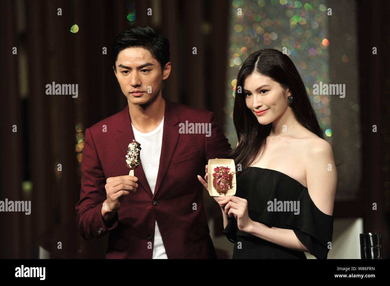 Chinese model and actress He Sui, right, model and actor Liu Chang show ...