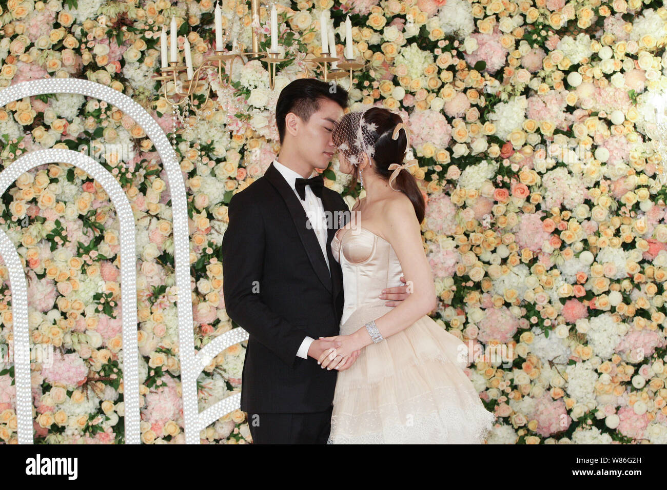 Taiwanese actress Michelle Chen, right, kisses her Chinese actor ...