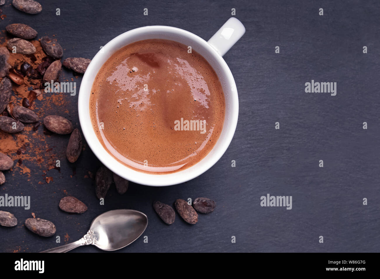 Hot chocolate or cocoa in a mug on the black background, top view Stock ...