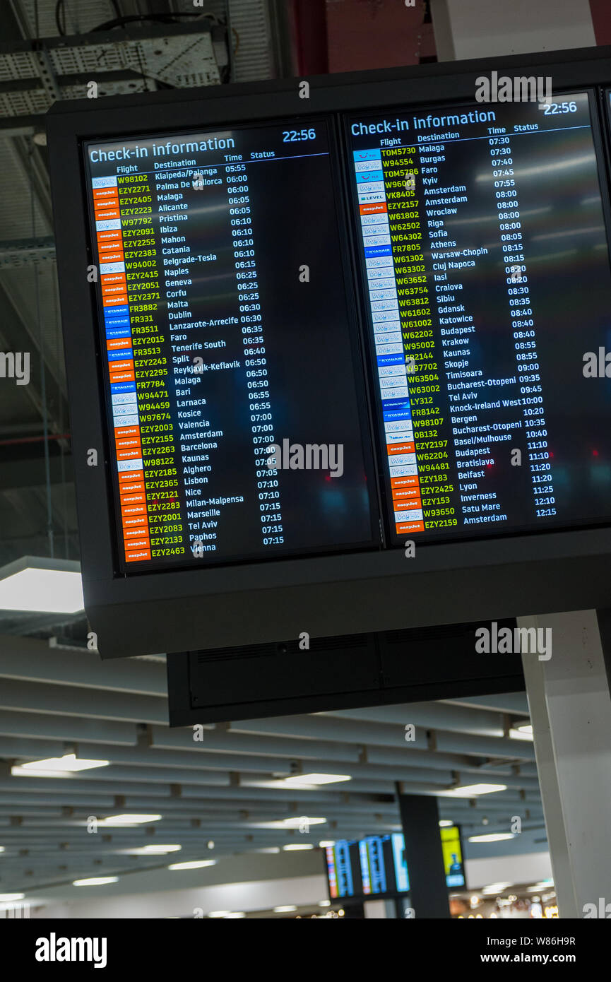Flight information screen in airport hi-res stock photography and ...