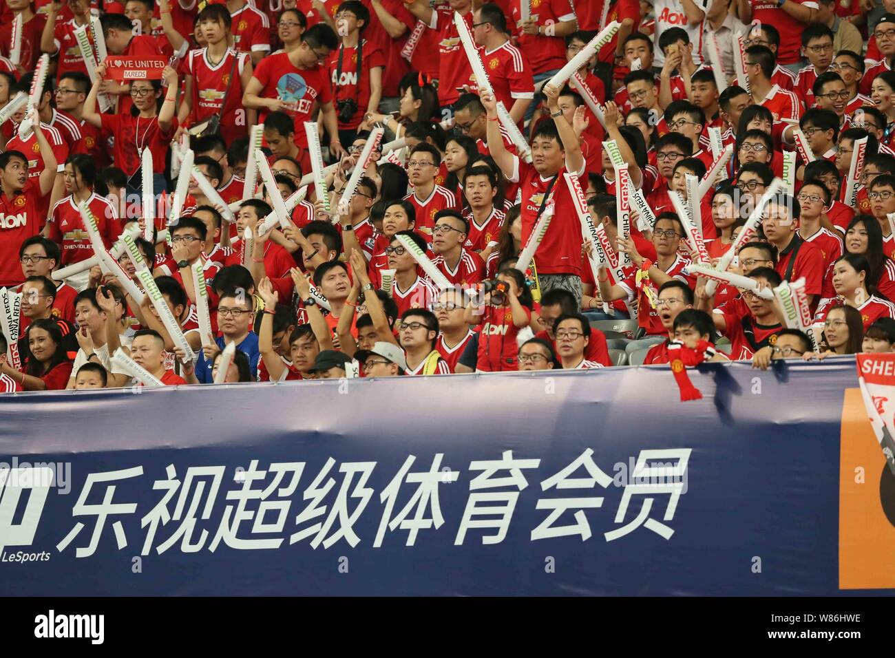 Chinese football fans shout slogans to show support for Manchester ...