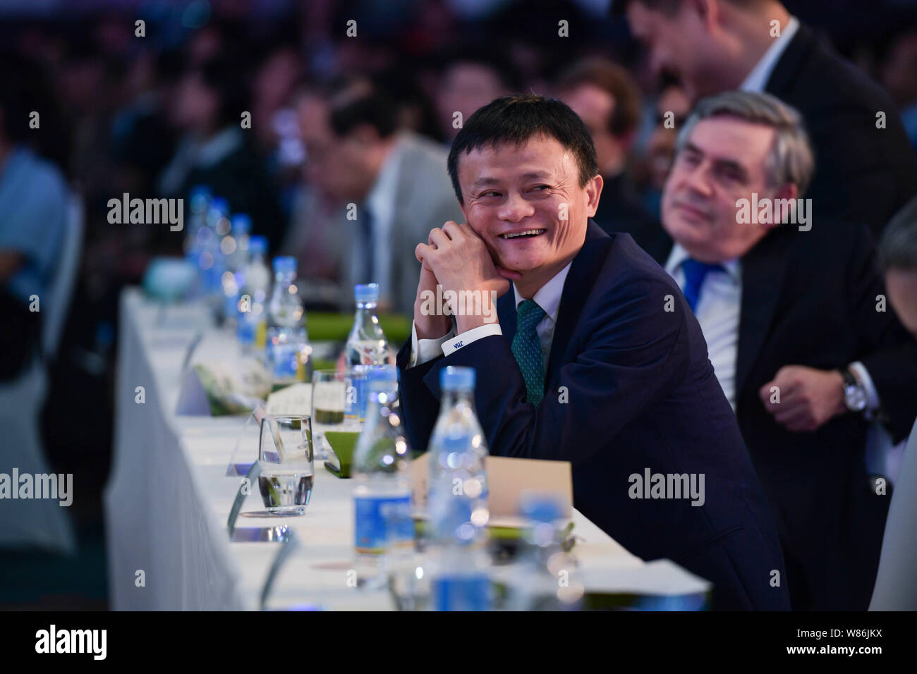 Jack Ma or Ma Yun, front, Chairman of Alibaba Group, reacts in front of ...