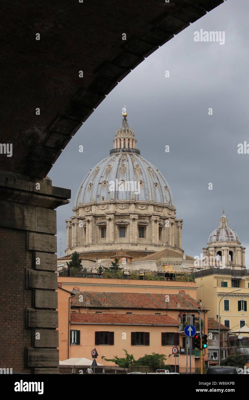 St Peter's Basilica dome under a bridge arch Rome, Italy Stock Photo ...