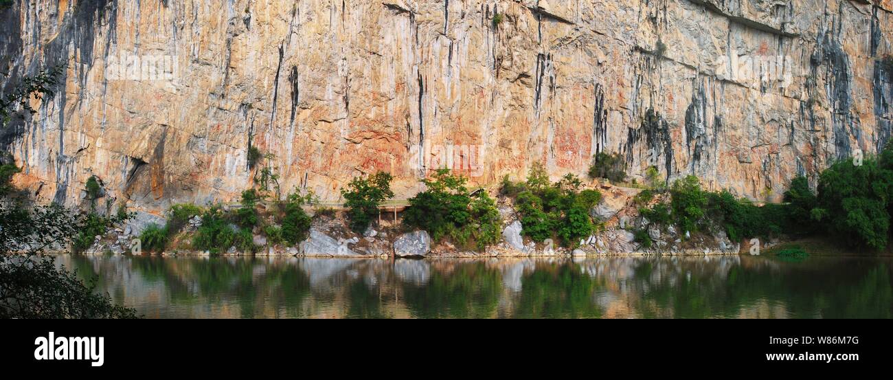 A view of rock paintings on the Huashan Mountain by the Zuojiang River ...