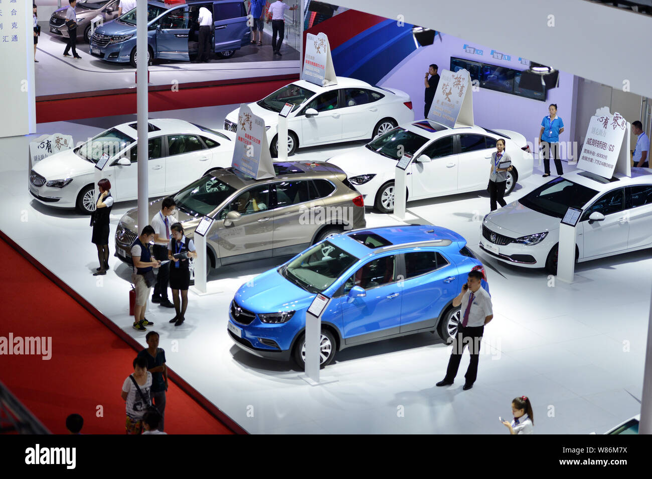 --FILE--Visitors look at Buick cars of SAIC-GM, a joint venture between ...