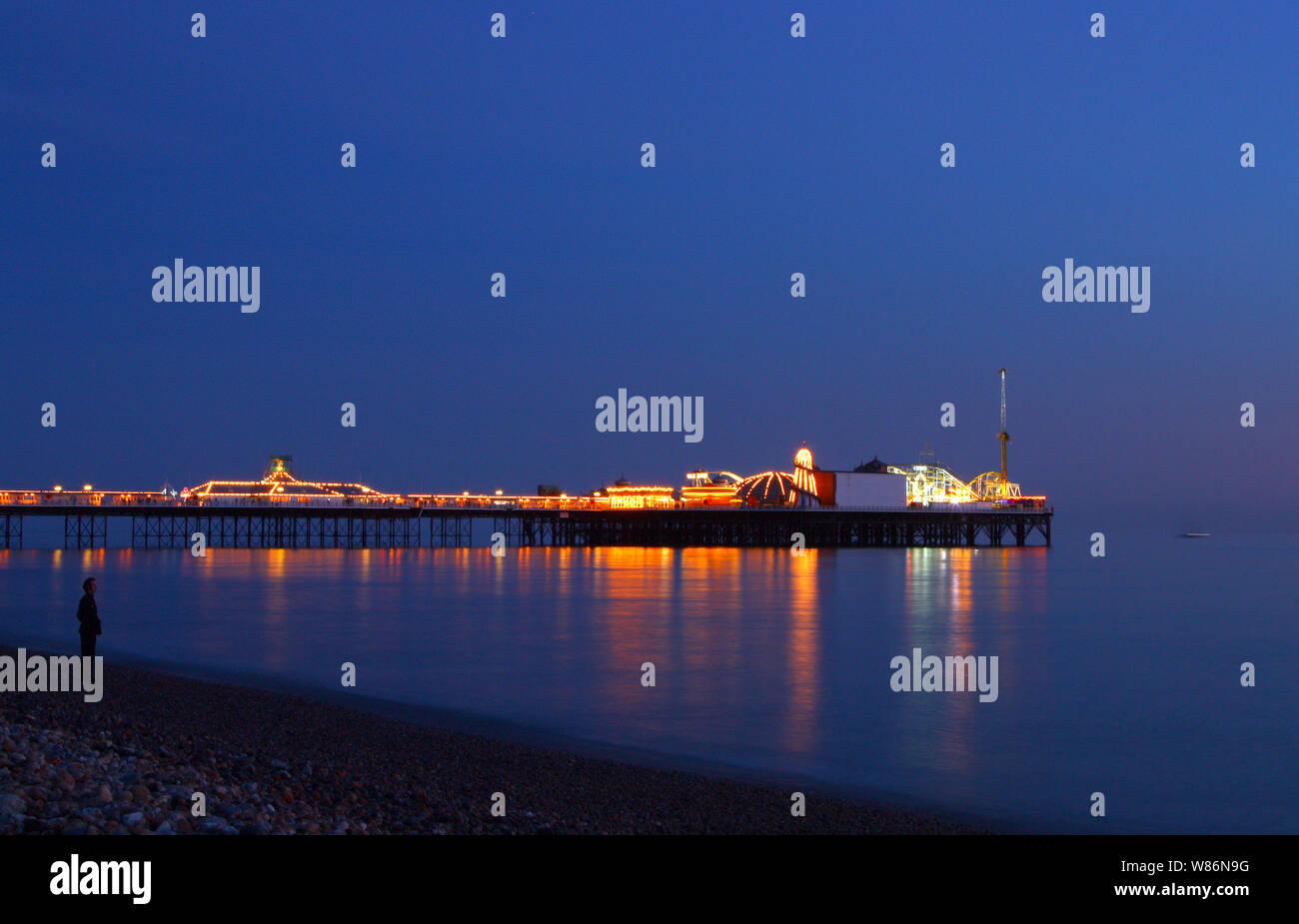 Slow exposure at sunset of Brighton Pier taken from the beach, East ...
