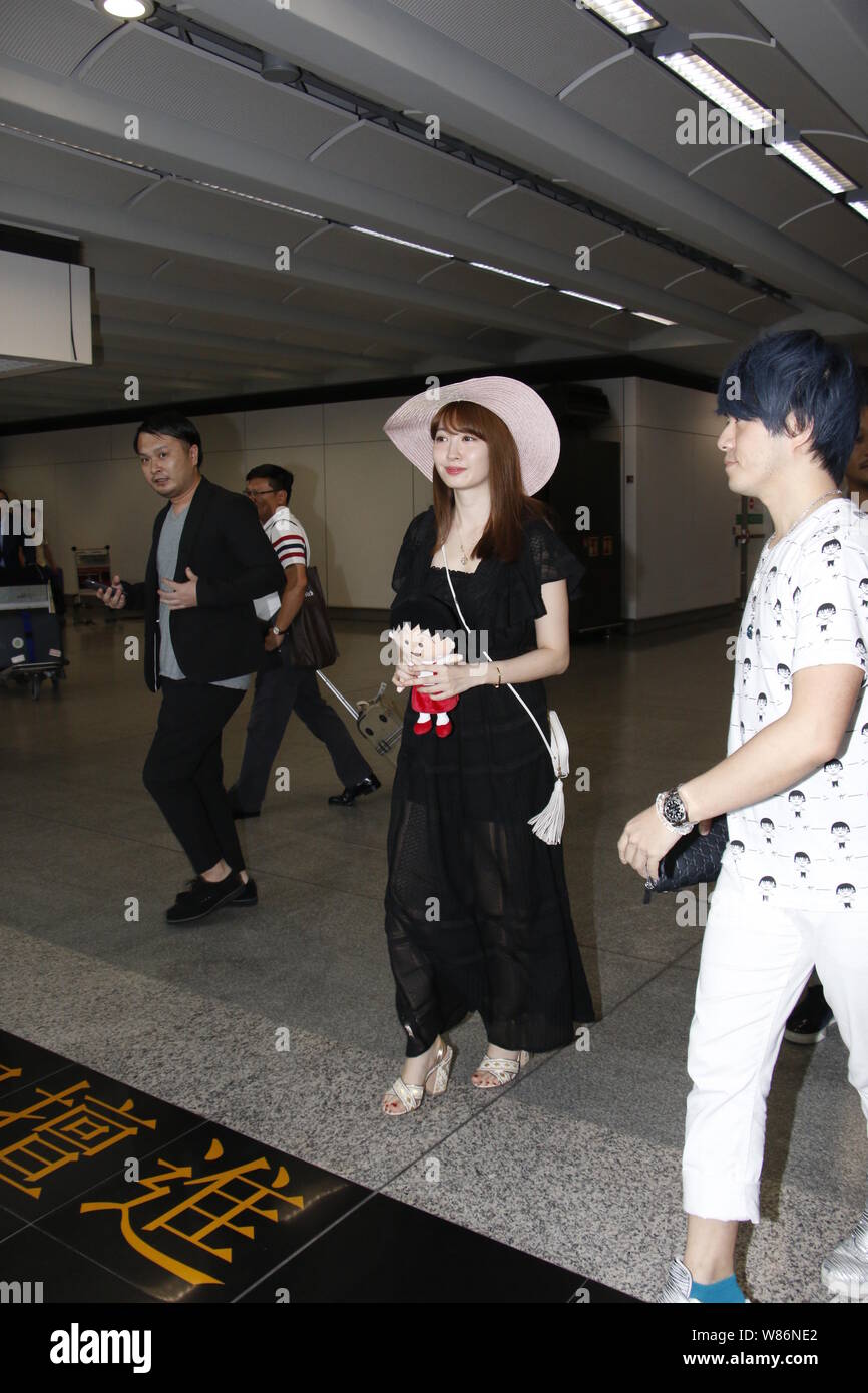 Japanese singer and actress Haruna Kojima, center, of Japanese idol ...
