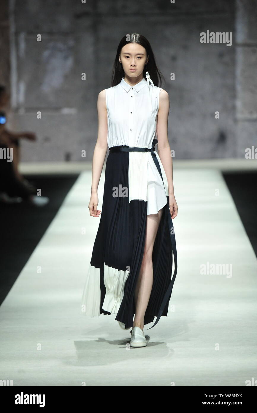 A model displays a new creation by Chinese fashion designer Lv Yan or ...