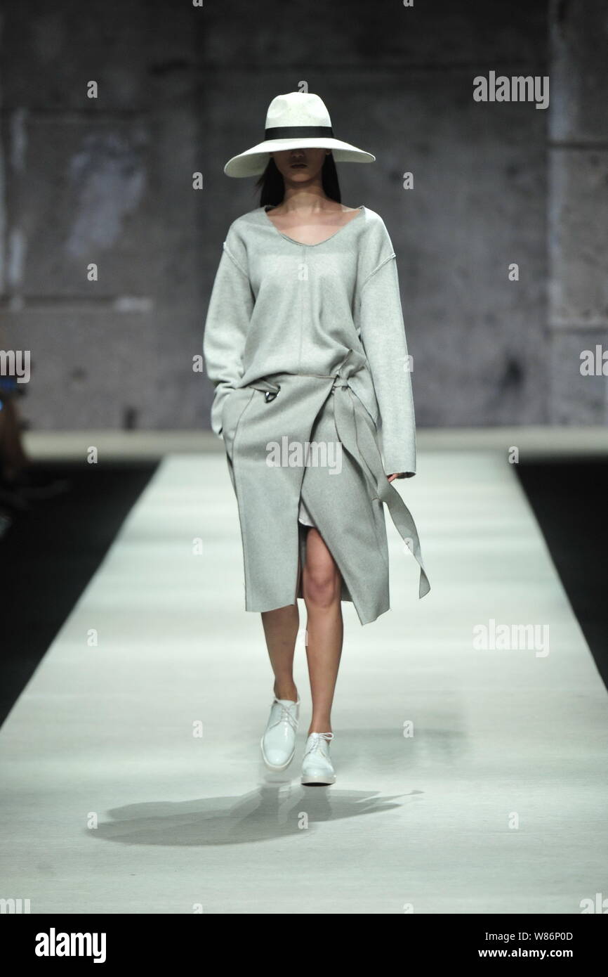 A model displays a new creation by Chinese fashion designer Lv Yan or ...