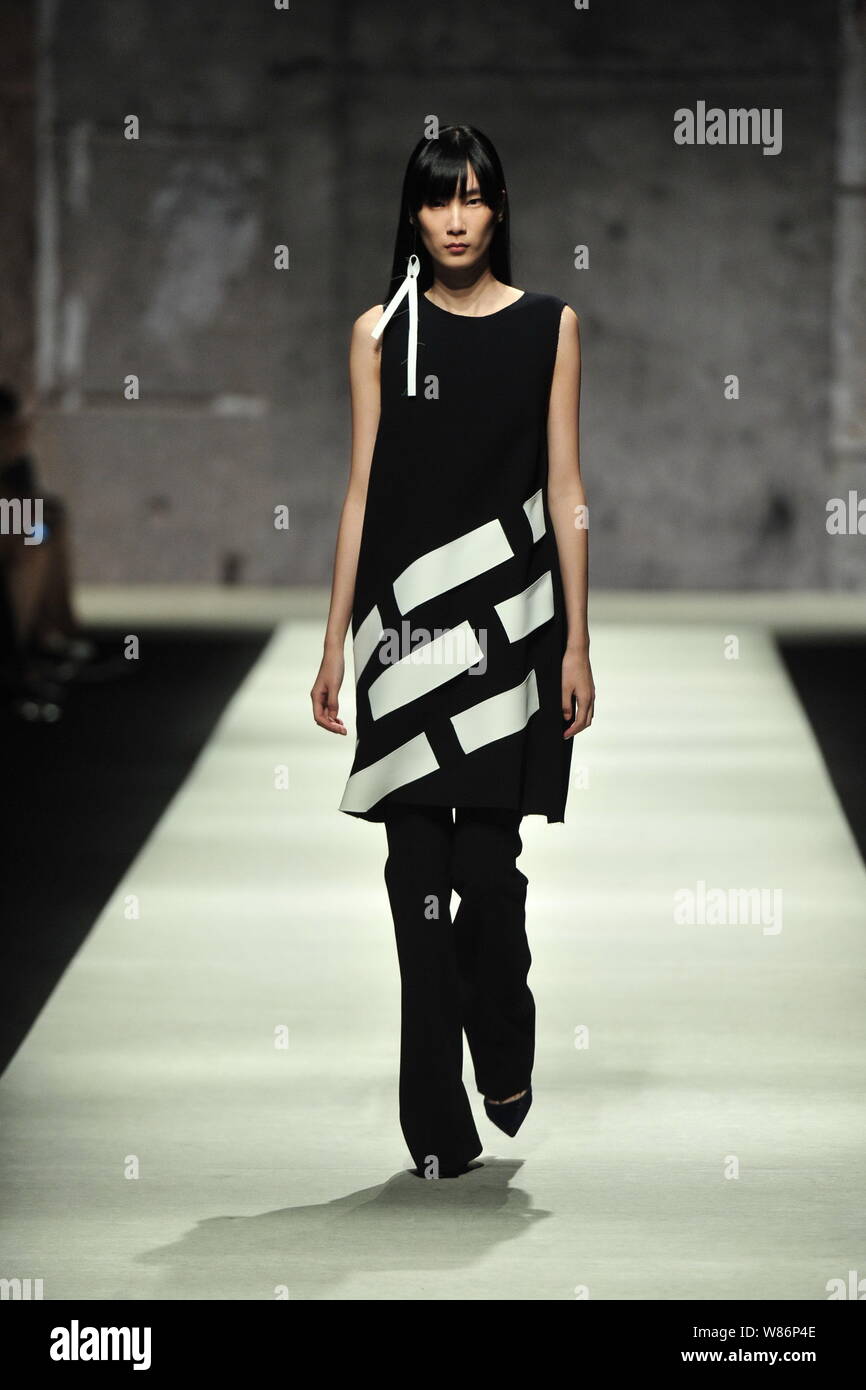 A model displays a new creation by Chinese fashion designer Lv Yan or ...