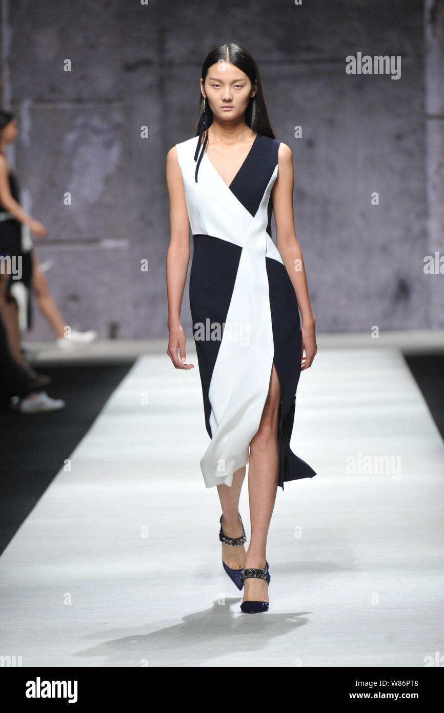 A model displays a new creation by Chinese fashion designer Lv Yan or ...