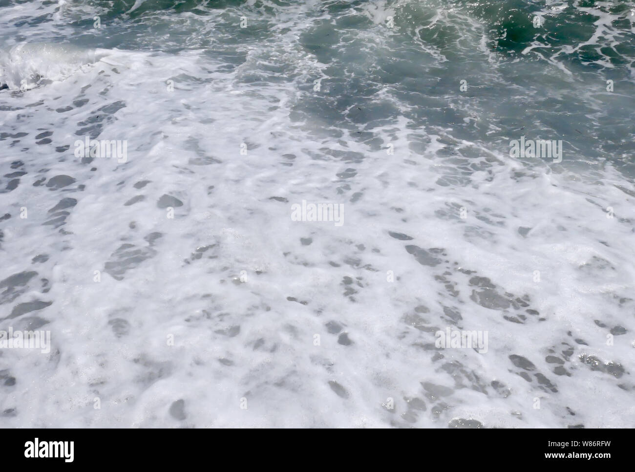 Foam on a sea water Stock Photo - Alamy