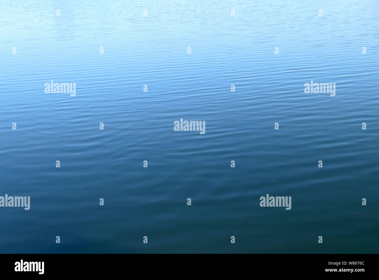 Blue water texture as background Stock Photo - Alamy