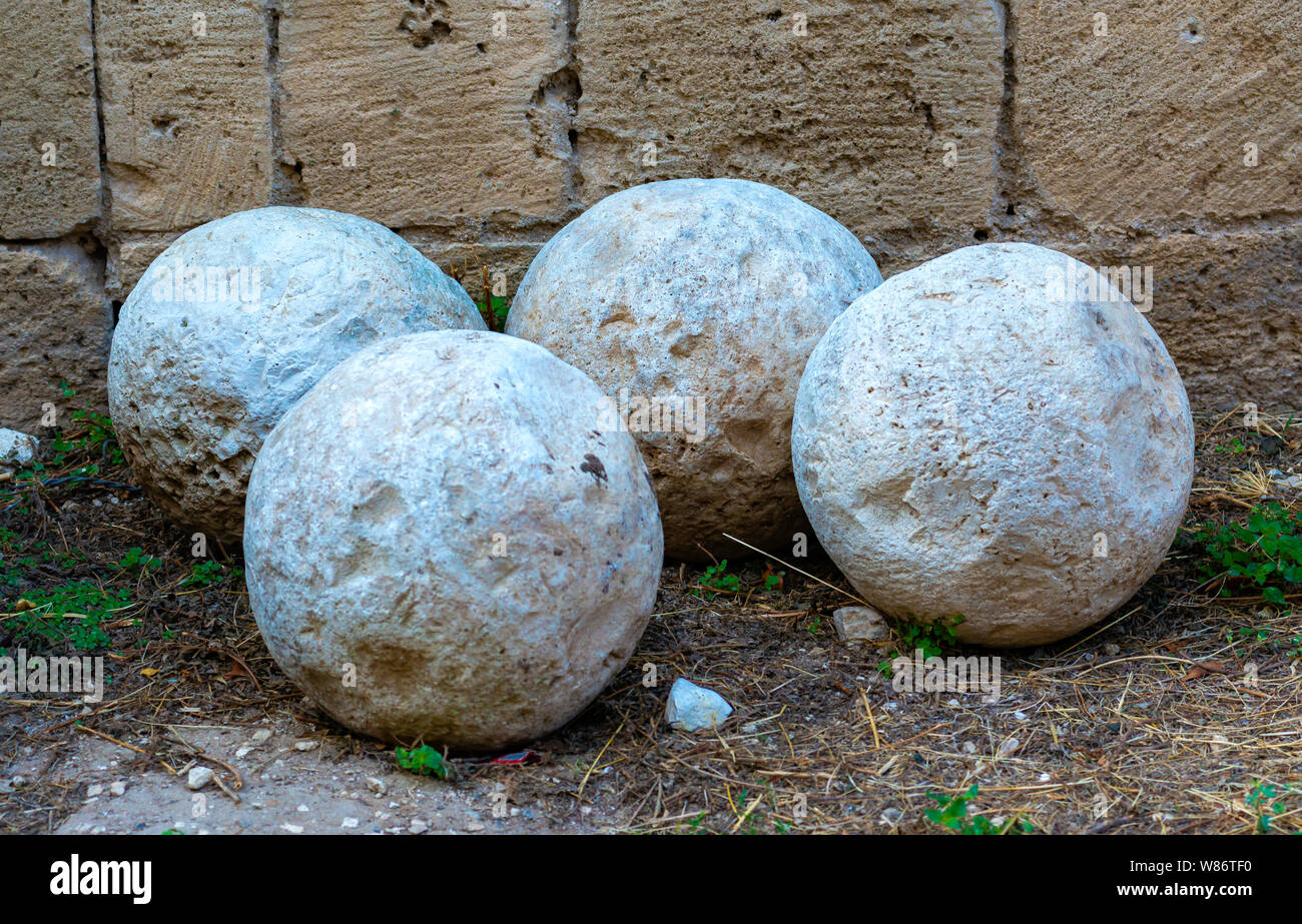 Group of ancient stone balls used in medieval cannons and preserved in ...