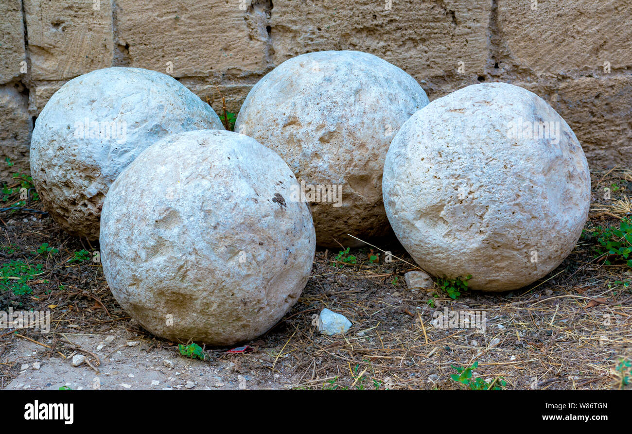 Group of ancient stone balls used in medieval cannons and preserved in ...