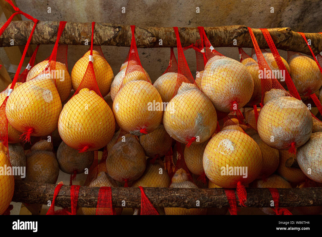 Many Forms Of Caciocavallo Cheese on maturation in cellar Stock Photo ...