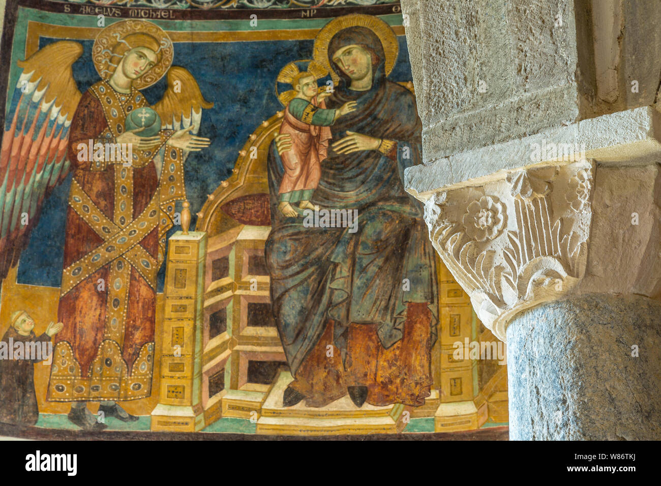 vivid fresco with Virgin enthroned and finely sculpted column capital ...