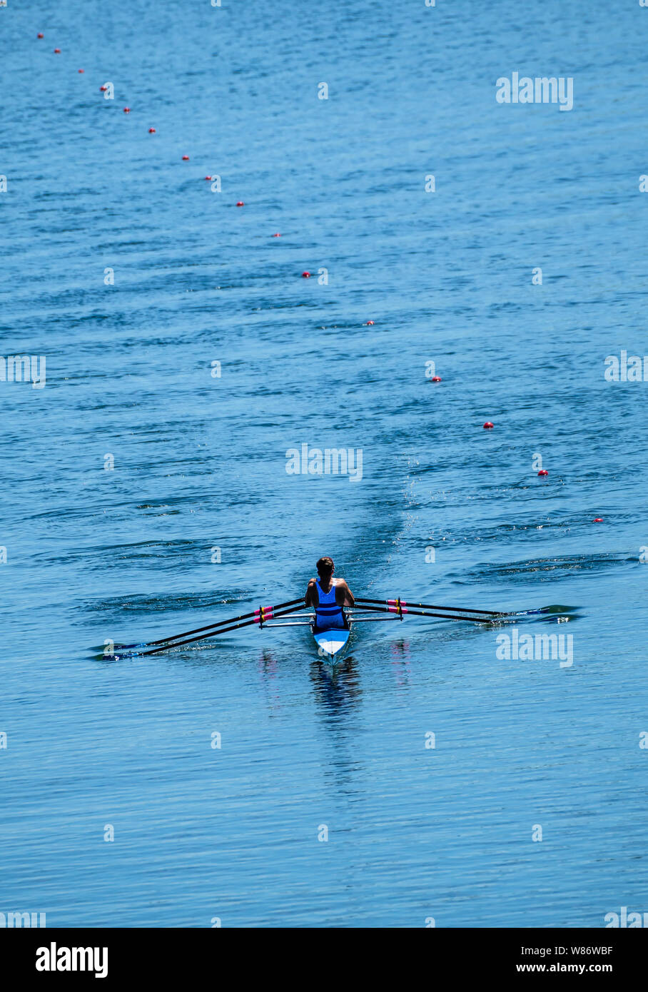 Two Male Rowers In A Double Racing Boat With Synchronous Oar Stroke ...