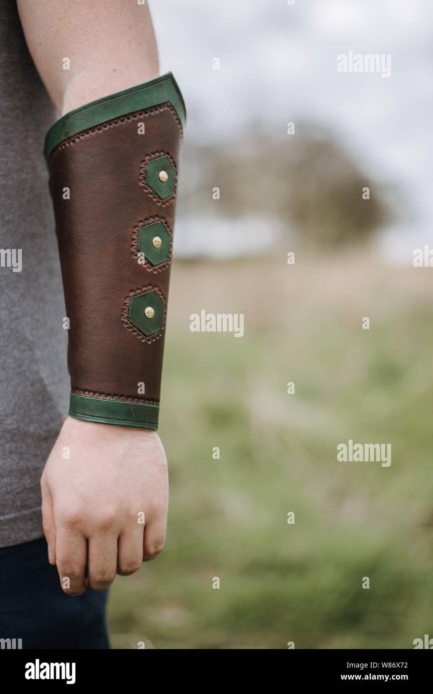 Closeup shot of a person wearing hand armor Stock Photo - Alamy