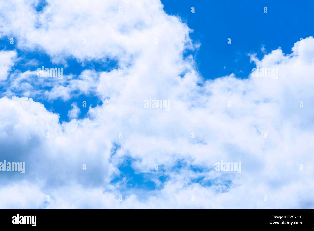 background - high midday blue sky with white cumulus clouds Stock Photo ...