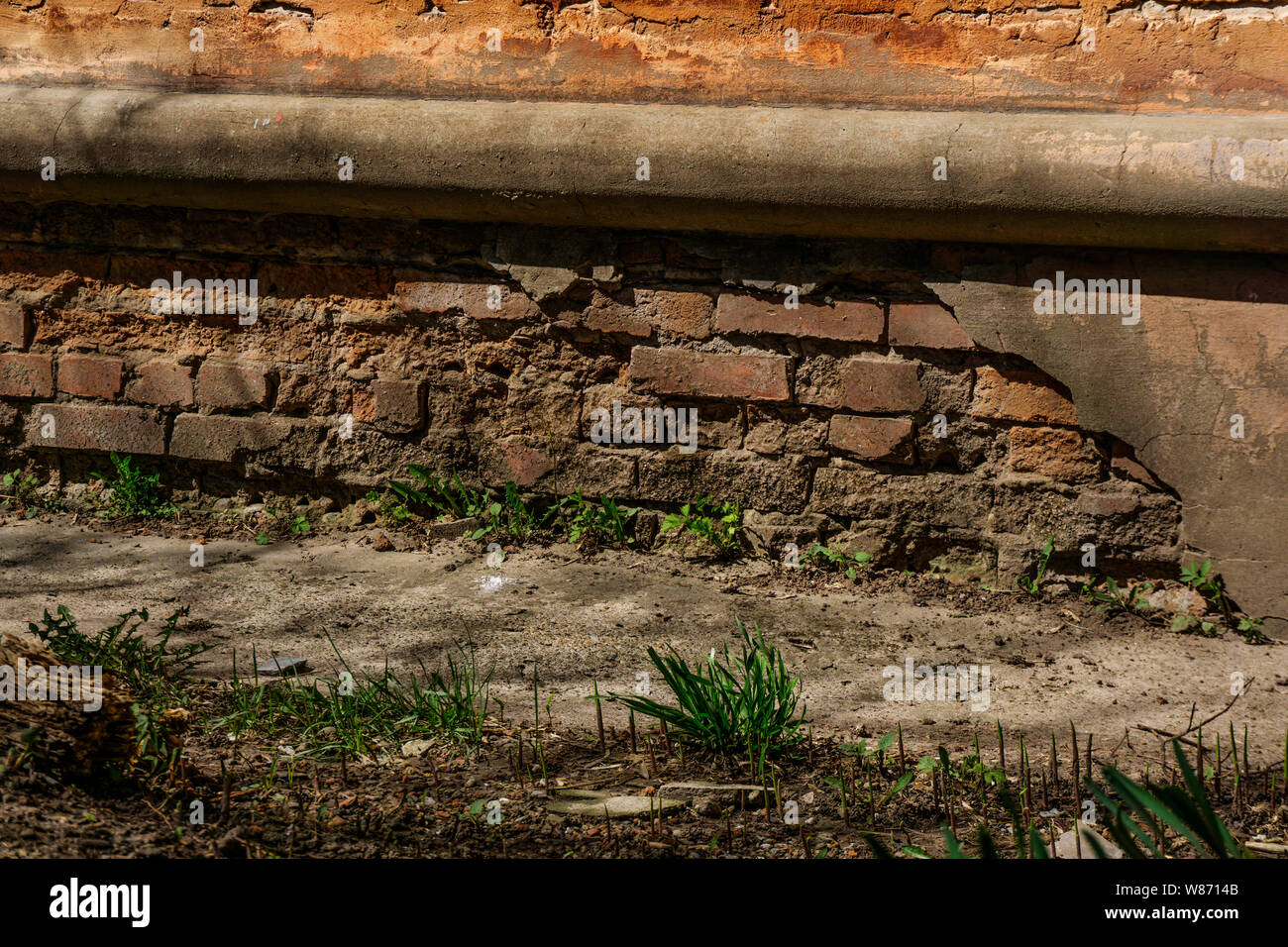collapsing basement of an old brick building with falling plaster Stock ...