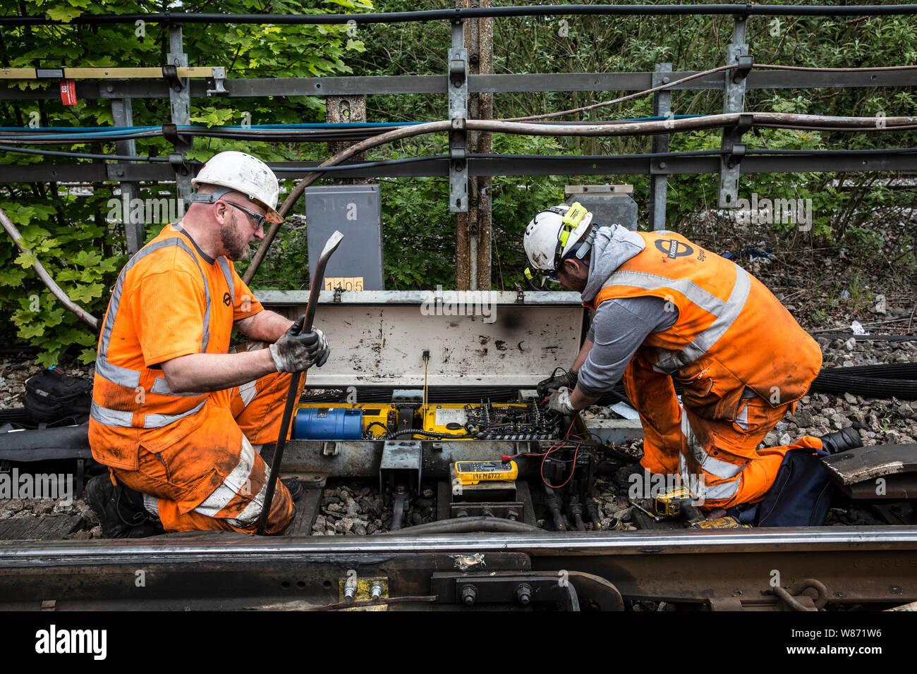 Maintenance team work on London Underground Central Line. Tack defect work grinding and skimming ...